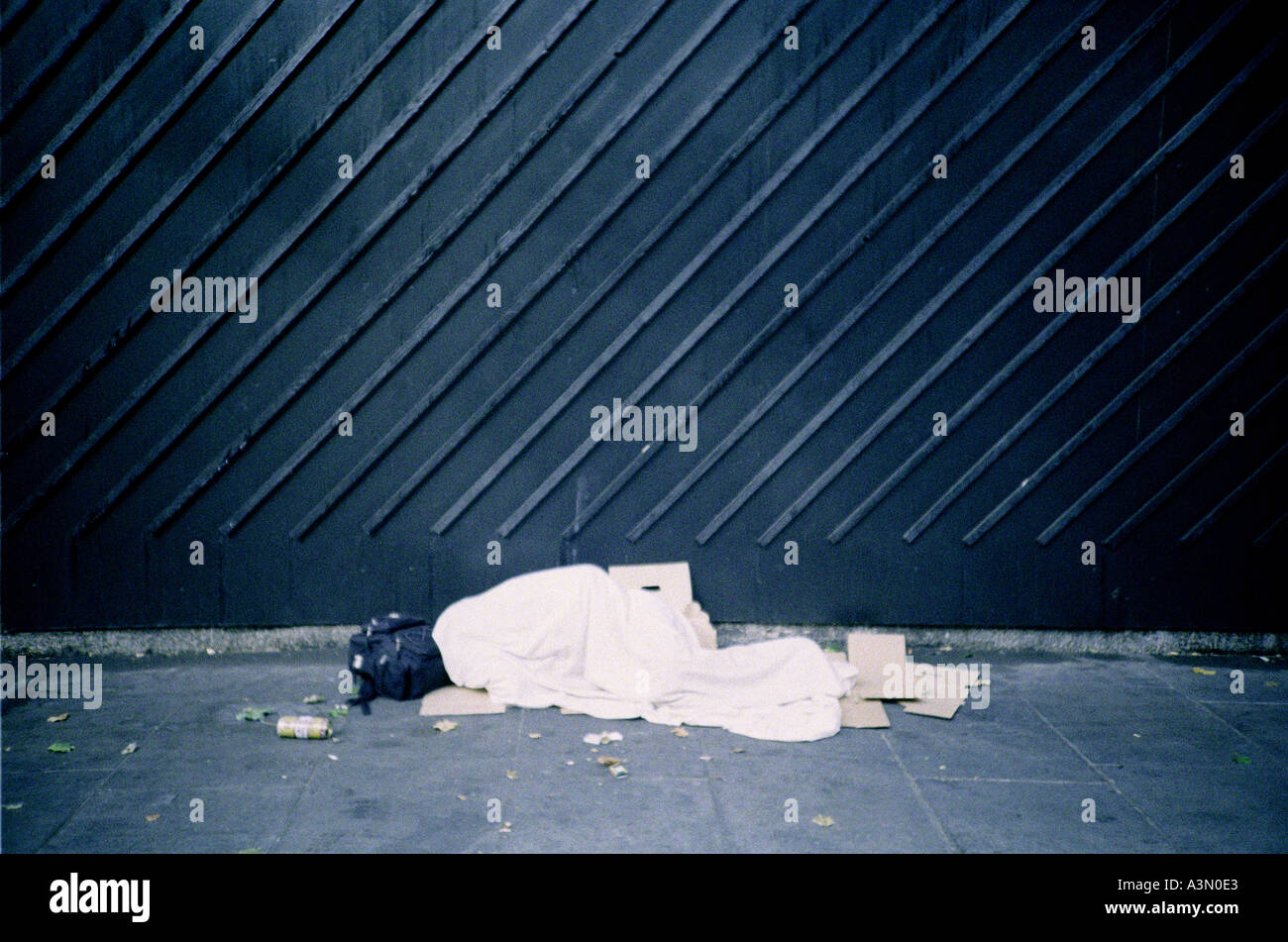 Covered homeless man sleeping in hi-res stock photography and images ...