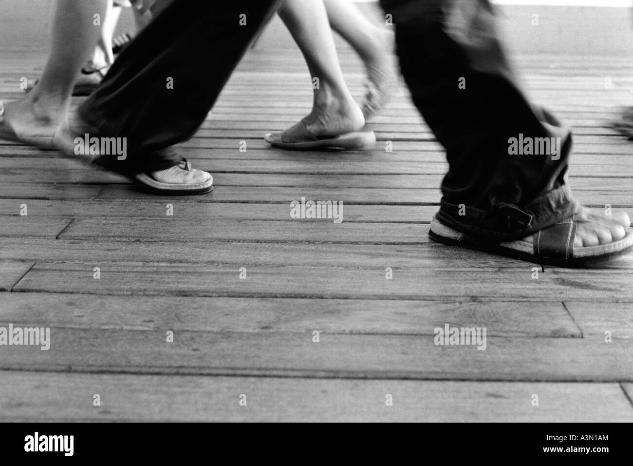 Feet of walking people Stock Photo - Alamy