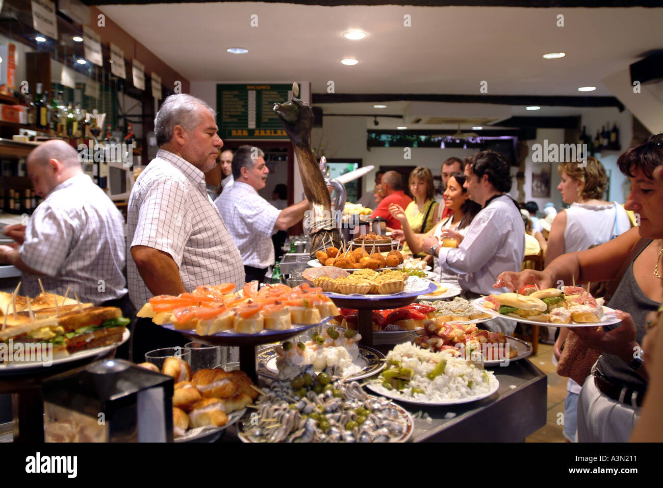 Interior of a tapas bar in the town of San Seabastian in northern Spain ...