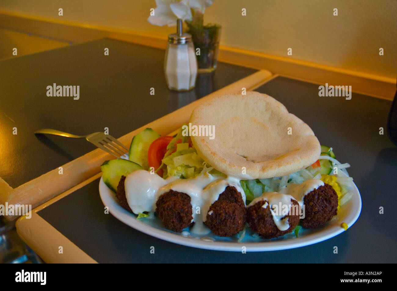 A vegetarian dish of falafel salad and pita bread in a Berlin ...