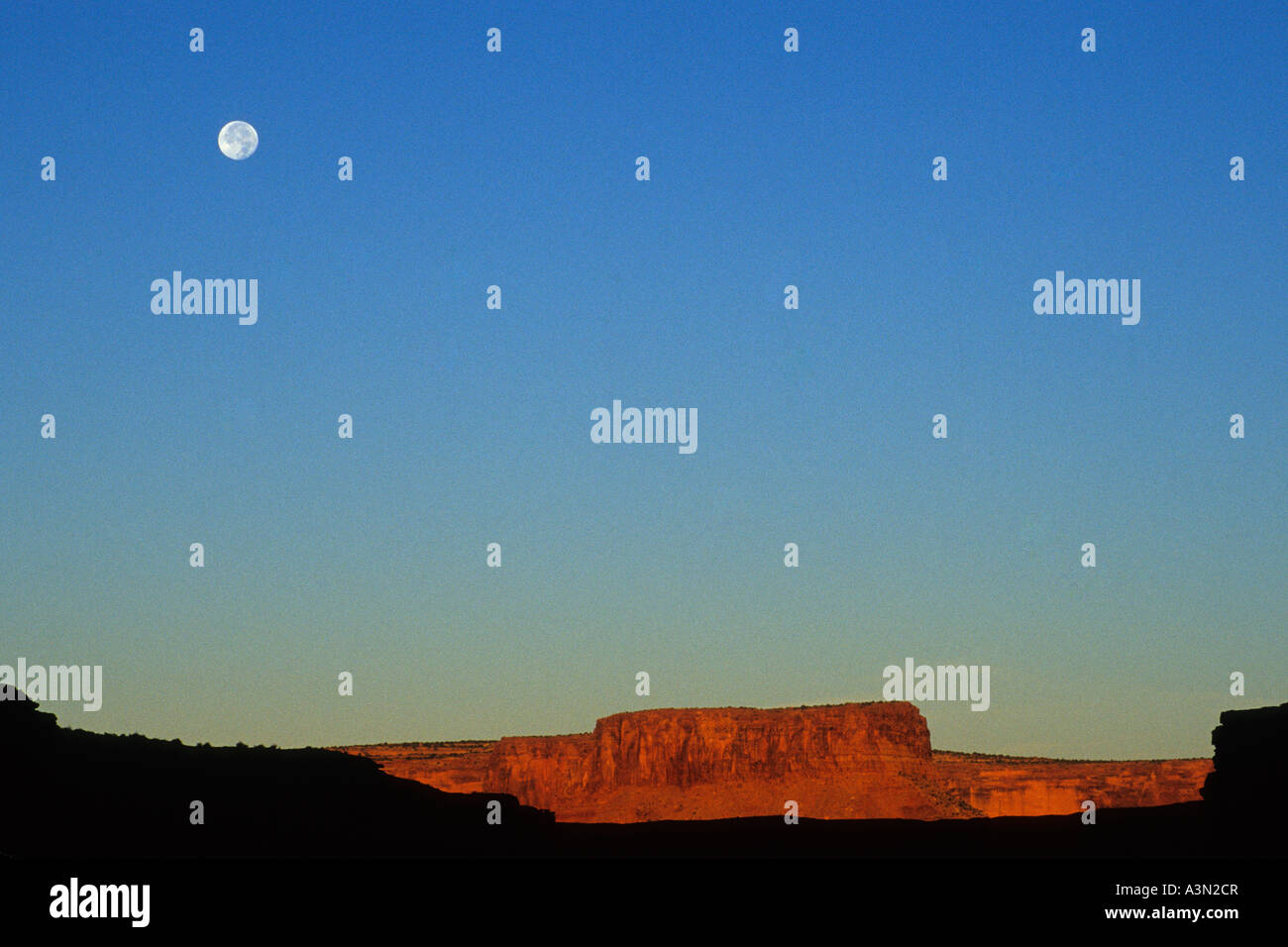Moon over sandstone cliffs at dawn, Utah Stock Photo - Alamy