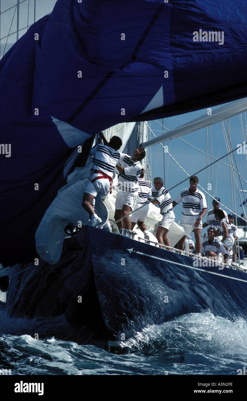 Foredeck crew aboard Endeavour drop the spinnaker Stock Photo - Alamy