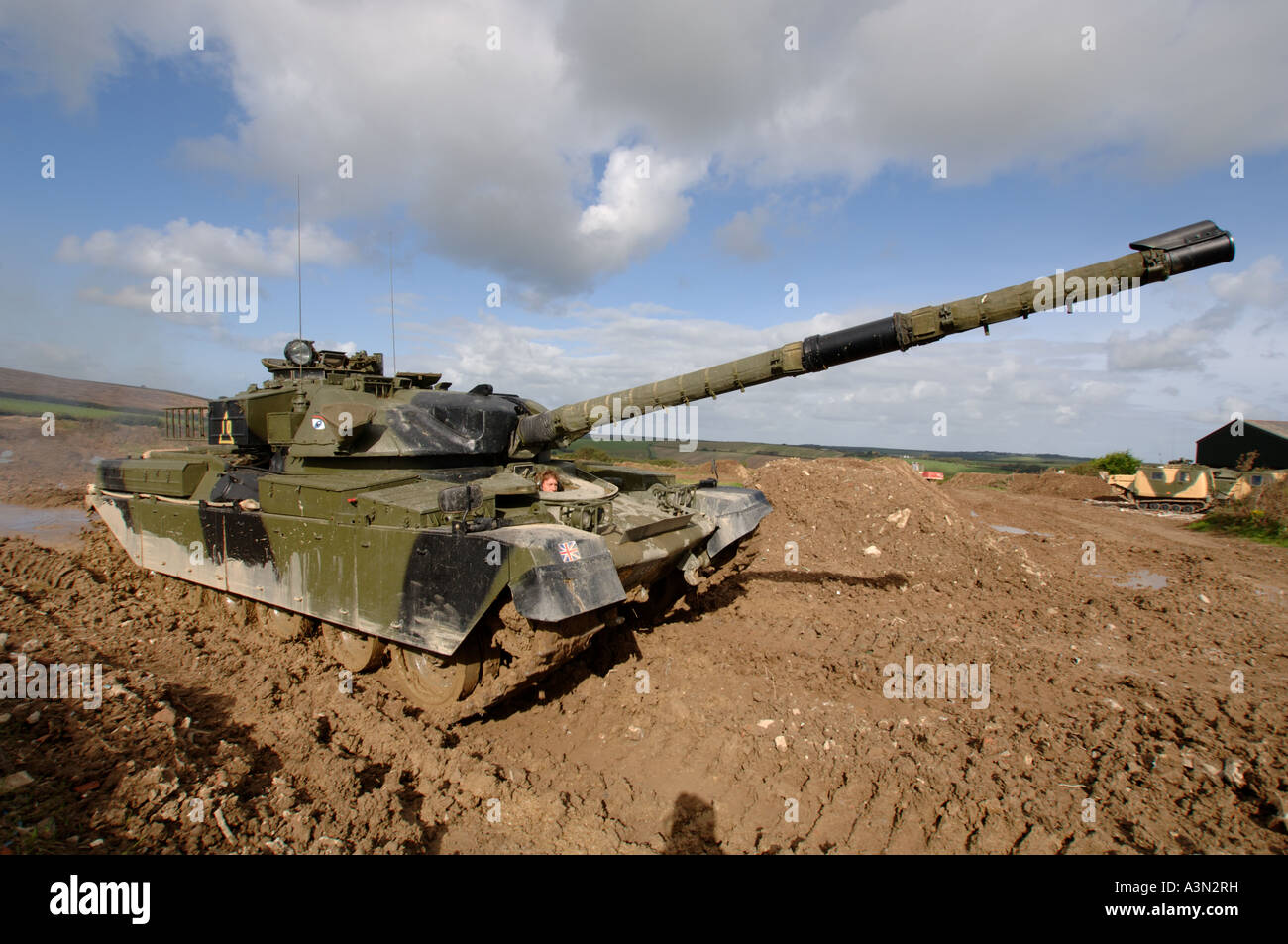 chieftan tank in action in muddy field in Bude . Cornwall Stock Photo ...