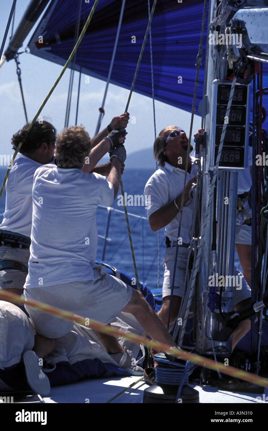 Crew hoist the heavy sails on a Maxi Stock Photo - Alamy