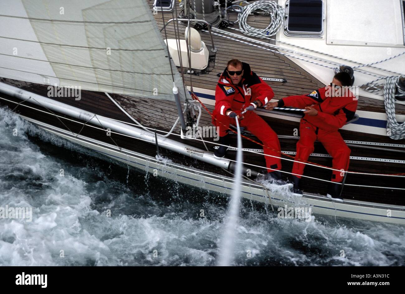 Crew dressed in Musto clothing onboard Swan 51 Formosa Stock Photo - Alamy