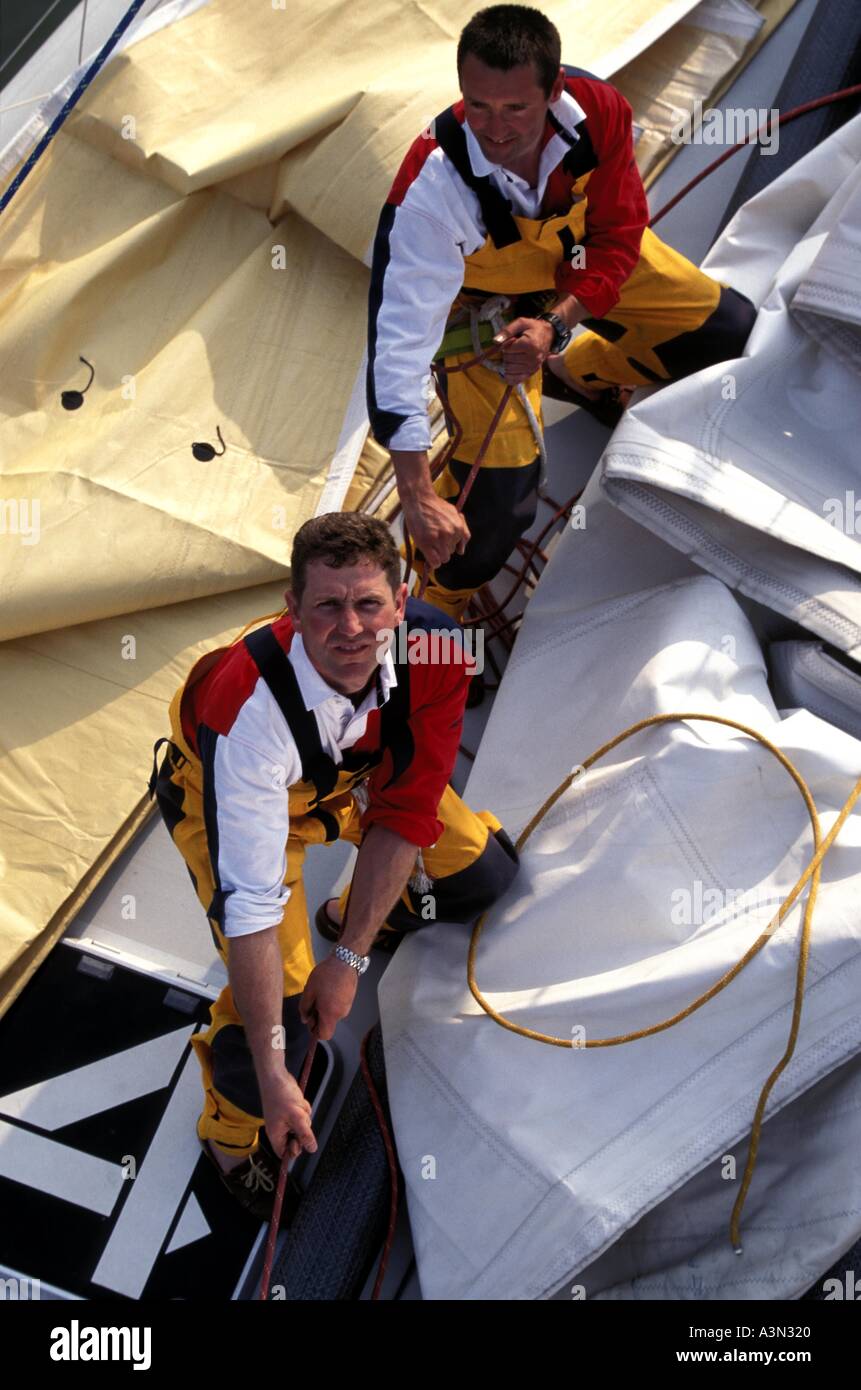 Nigel Musto and Andy Hindley hoist the sails Stock Photo - Alamy