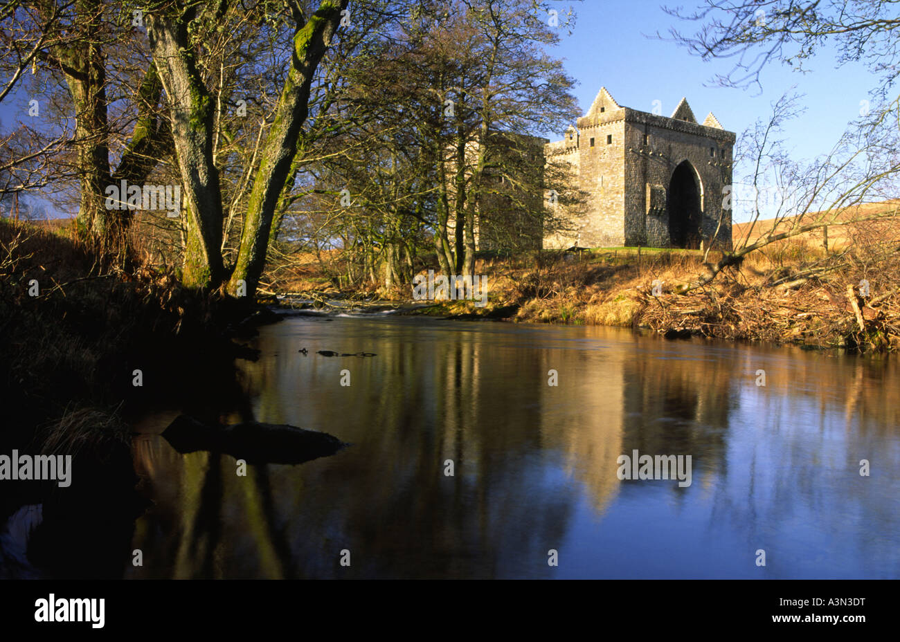 The foreboding eerie evil lonely ruins of Hermitage Castle reflected in ...