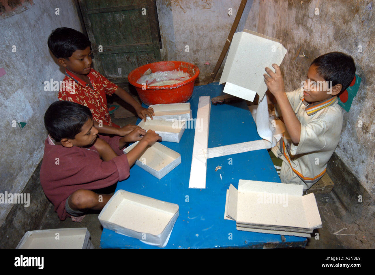Children work in a factory making cardboard boxes in Dhaka Bangladesh ...