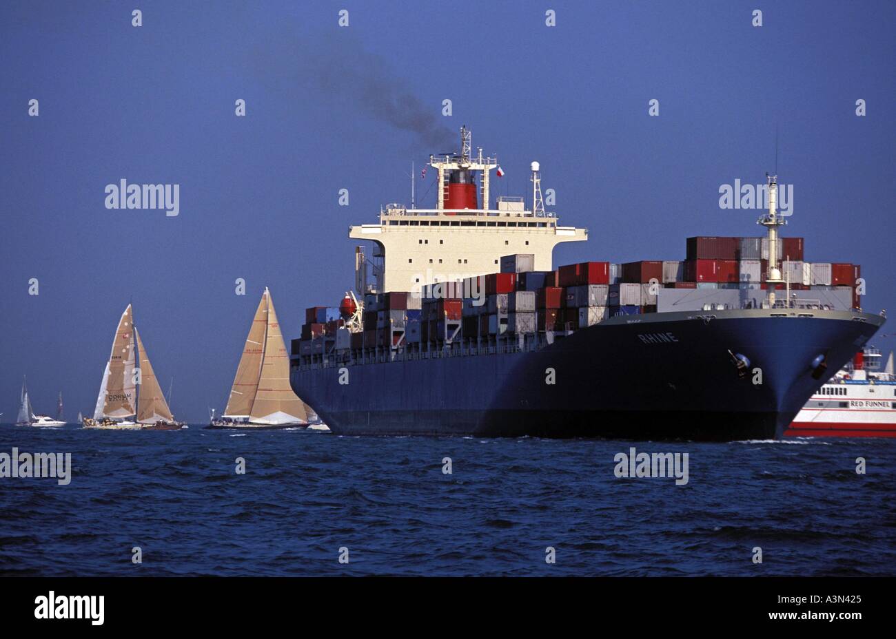 Container ship and sailing yachts in the Solent shipping channel Stock ...