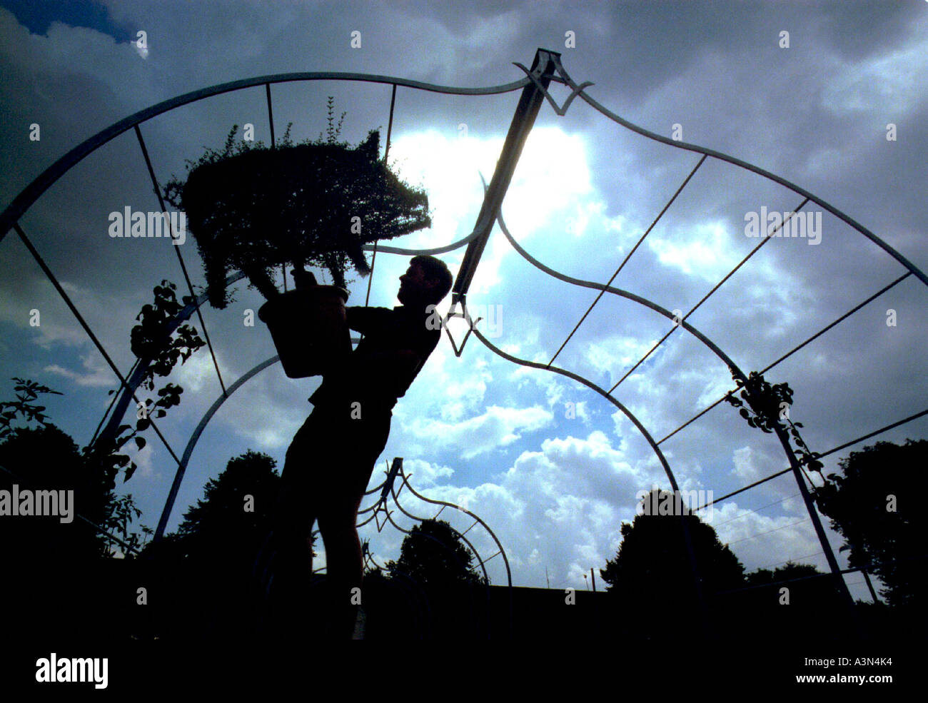Topiary pig held aloft under a Victorian arch in a Royal garden Stock ...