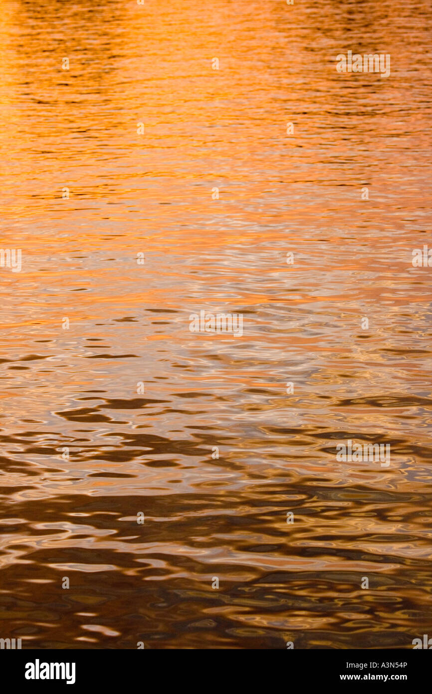 Ripples on water at sunset Stock Photo - Alamy