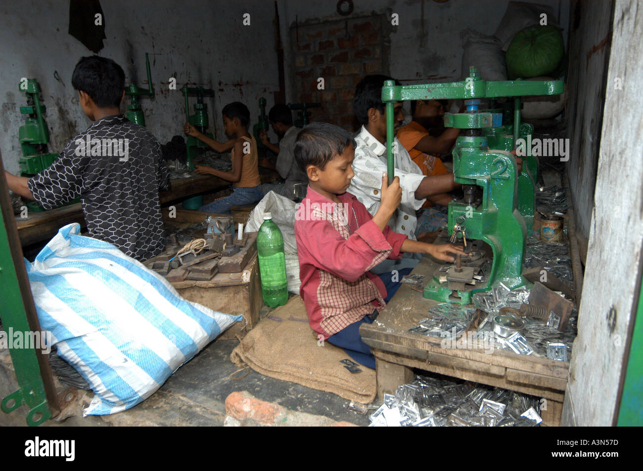 Children work in factories in Dhaka, Banghladesh. They are often run ...