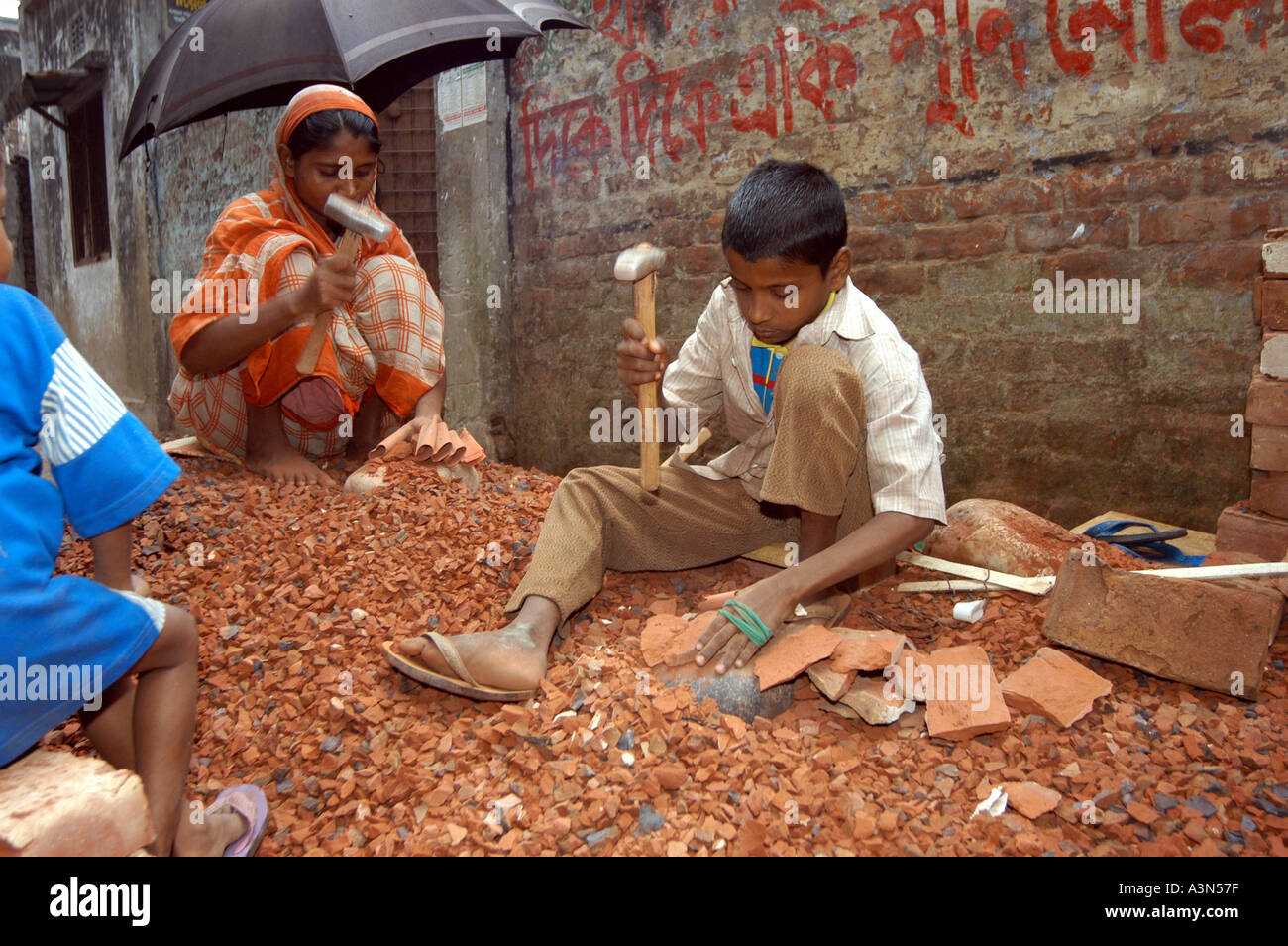 Children break bricks for road construction Dhaka Bangladesh Stock ...