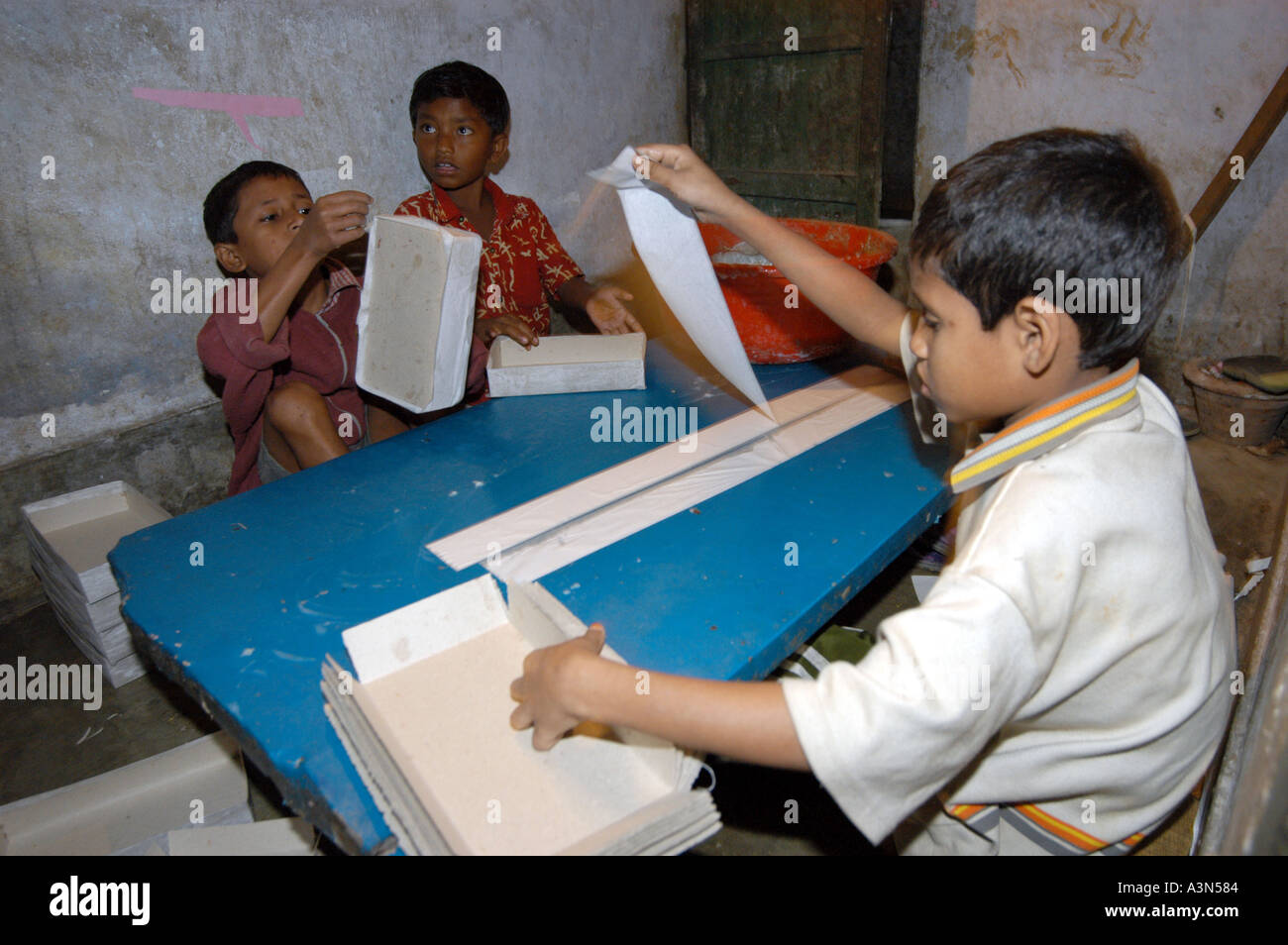 Children work in factory making cardboard boxes in Dhaka Bangladesh ...