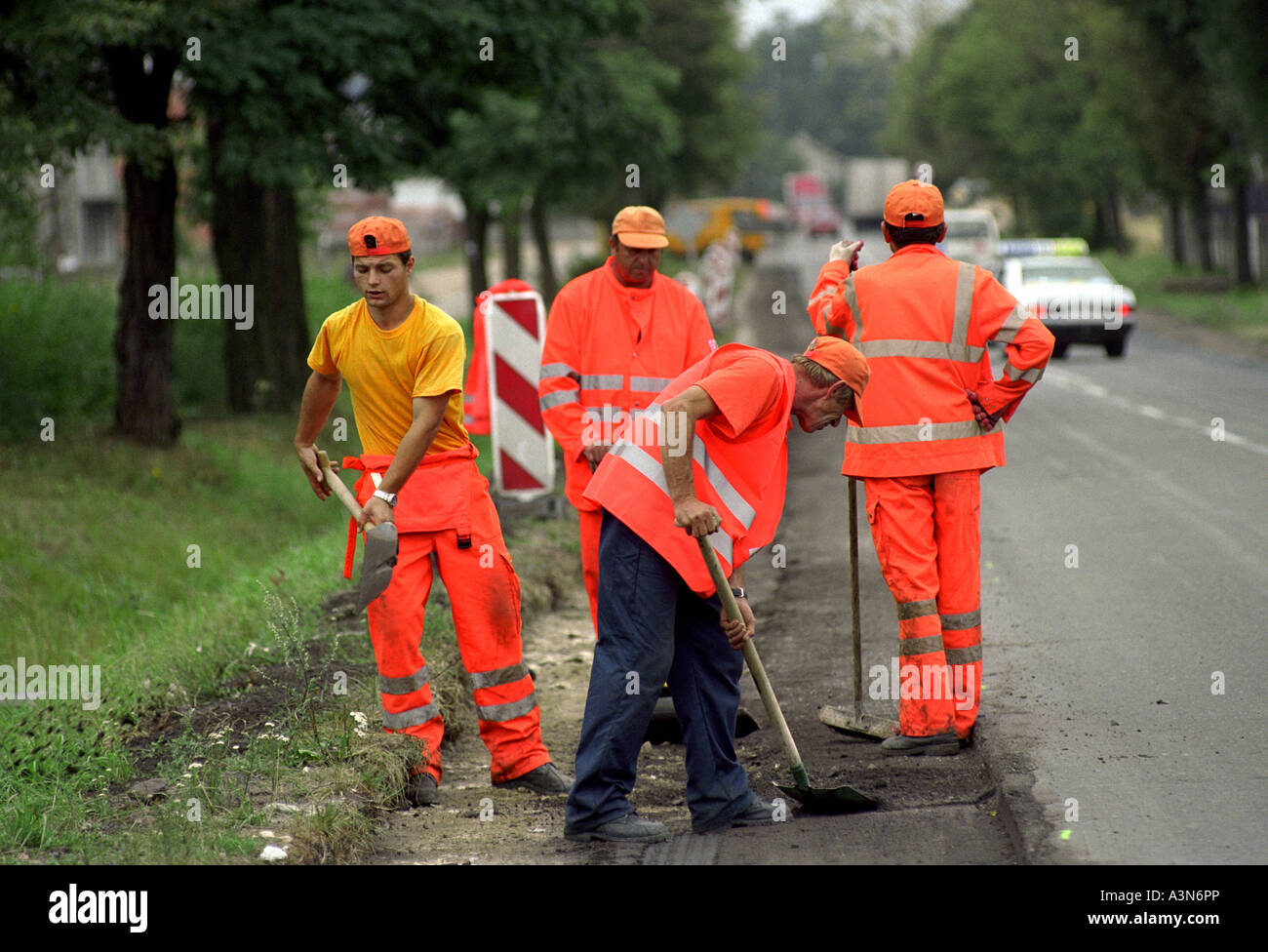 Workers during road repairs, Poland Stock Photo - Alamy