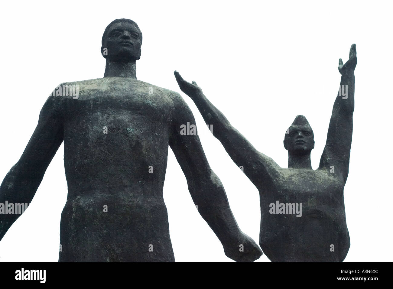 Photo of Communist Statue of two Heroic Russian Men On White Background ...