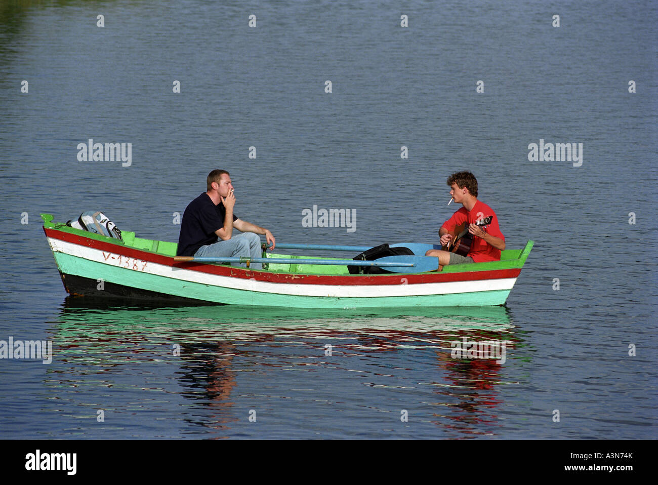 Two young men on a rowboat at the Galve Lake, Lithuania Stock Photo - Alamy