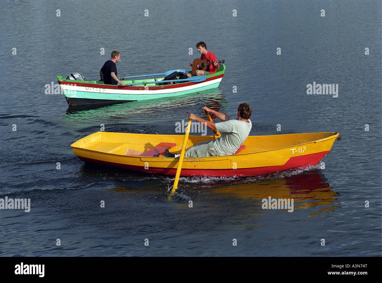 Men on rowboats at the Galve Lake, Lithuania Stock Photo - Alamy