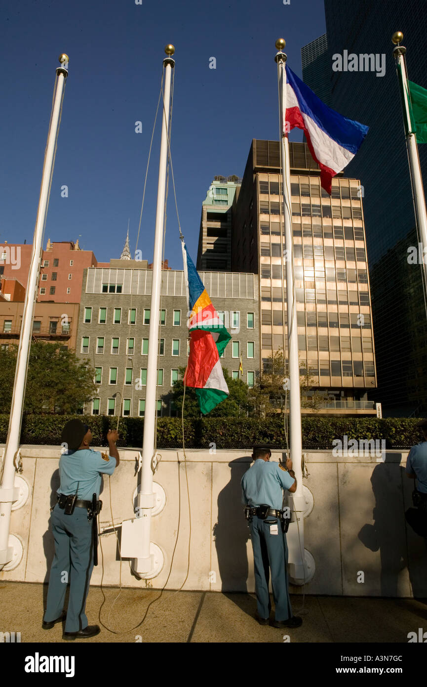 United Nations security guards raise the member states flags in front ...