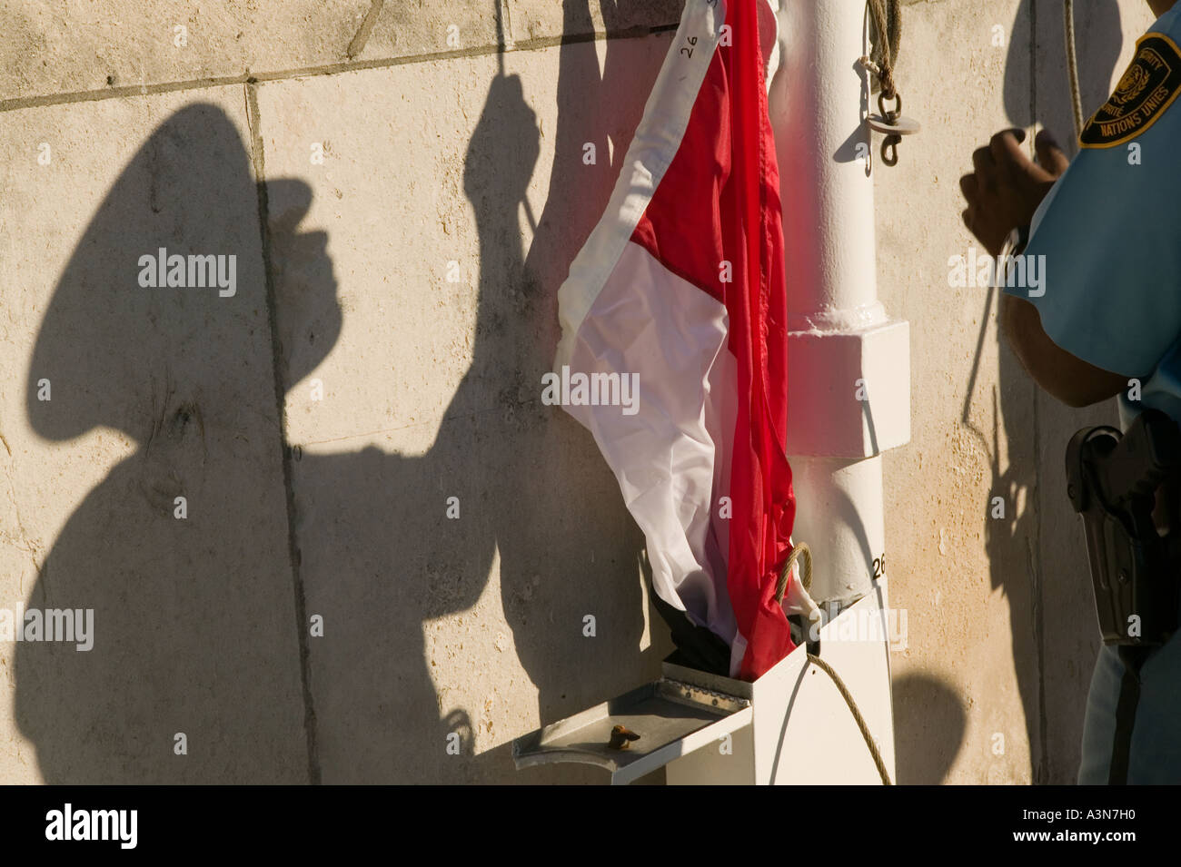 United Nations security guards raise the member states flags in front ...