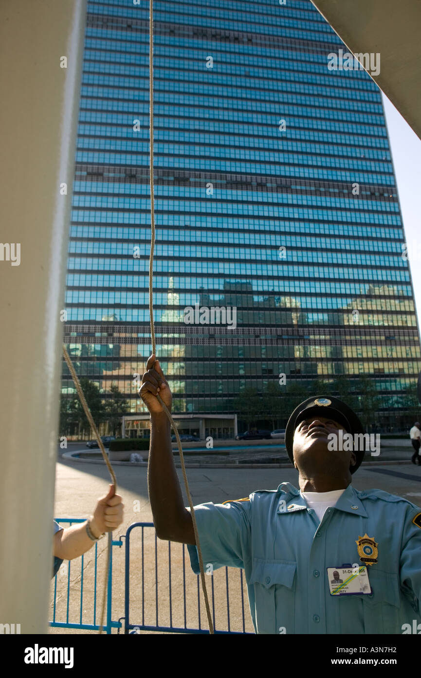 United Nations security guards raise the member states flags in front ...
