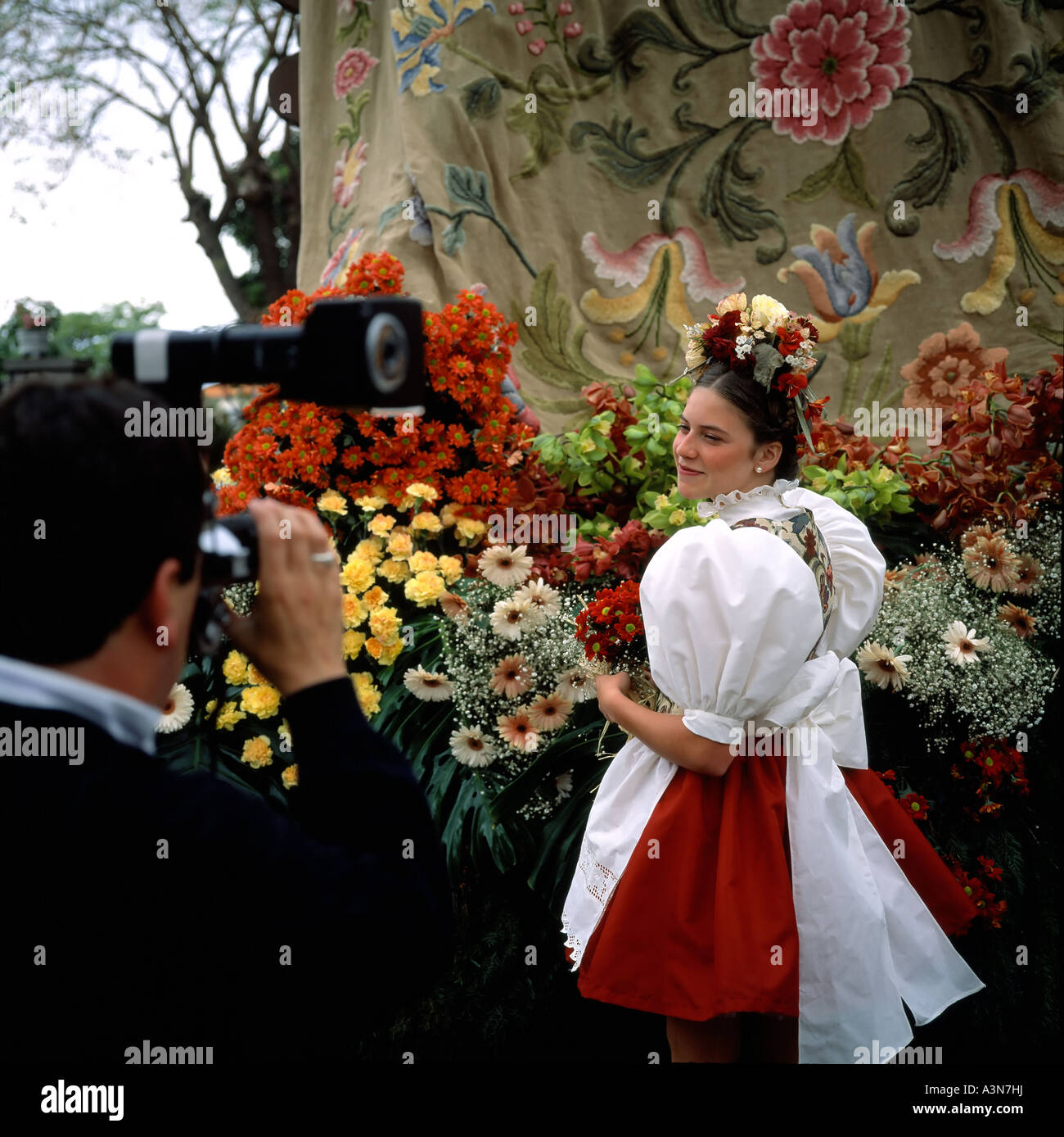 YOUNG WOMAN WITH TRADITIONAL COSTUME POSING FOR THE CAMERA AT SPRING ...