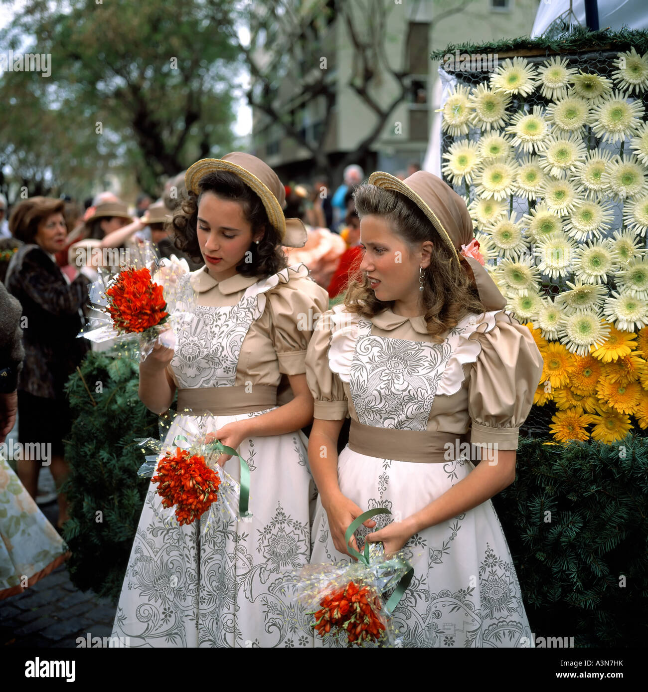 TWO GIRLS WITH TRADITIONAL COSTUME AND HAT AT SPRING FLOWER FESTIVAL ...