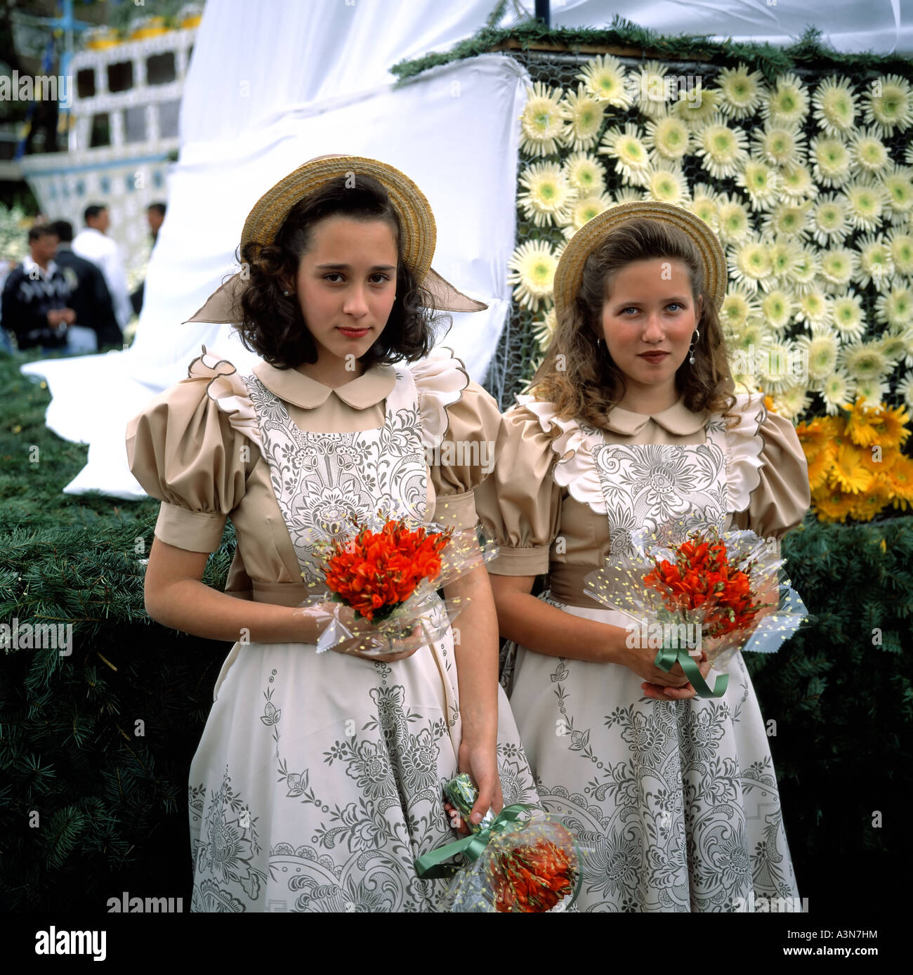 TWO GIRLS WITH TRADITIONAL COSTUME AND HAT AT SPRING FLOWER FESTIVAL ...