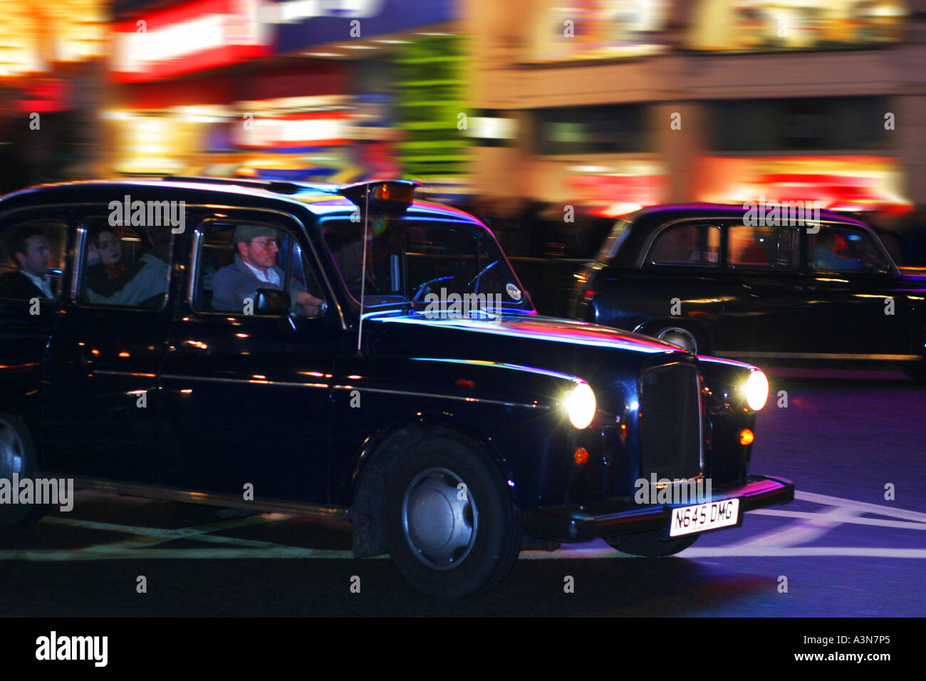 London Taxi cab at night Stock Photo - Alamy
