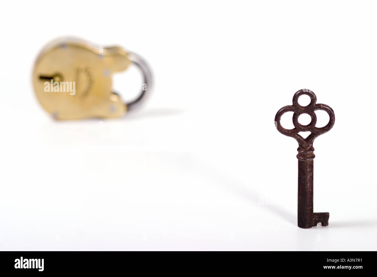 Brass padlock and ornate key Stock Photo - Alamy