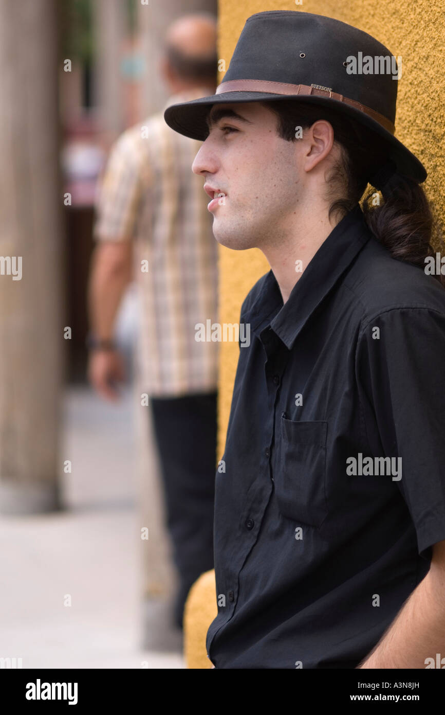 Young man at shopping mall Stock Photo - Alamy