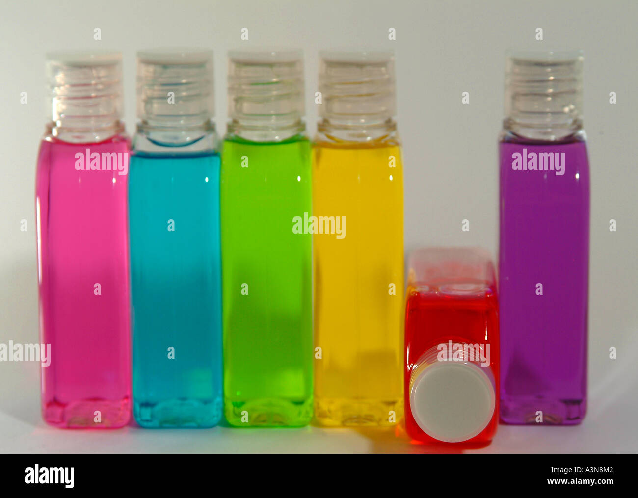 Bottles of multi coloured liquid Stock Photo - Alamy