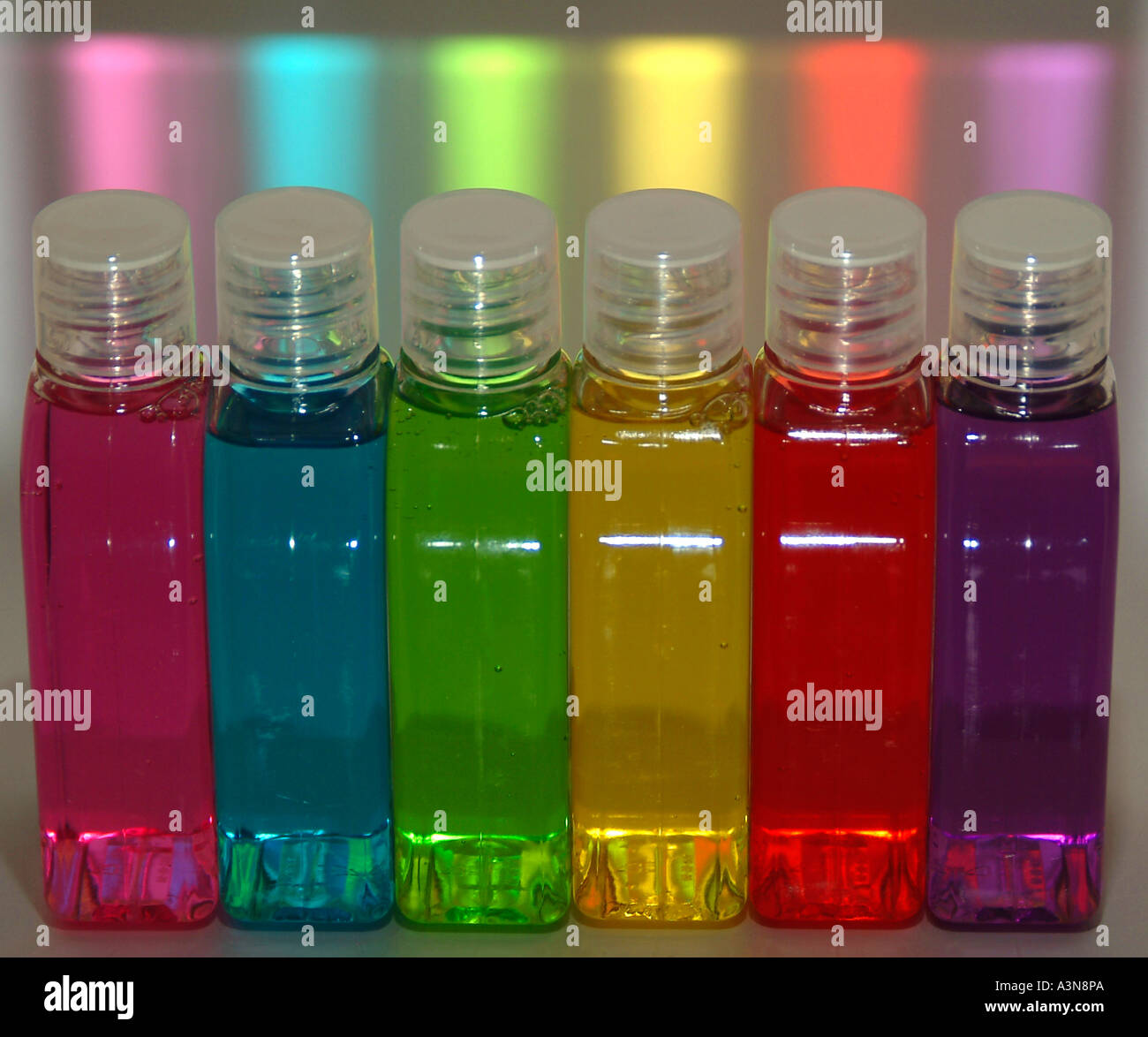 Bottles of multi coloured liquid Stock Photo - Alamy