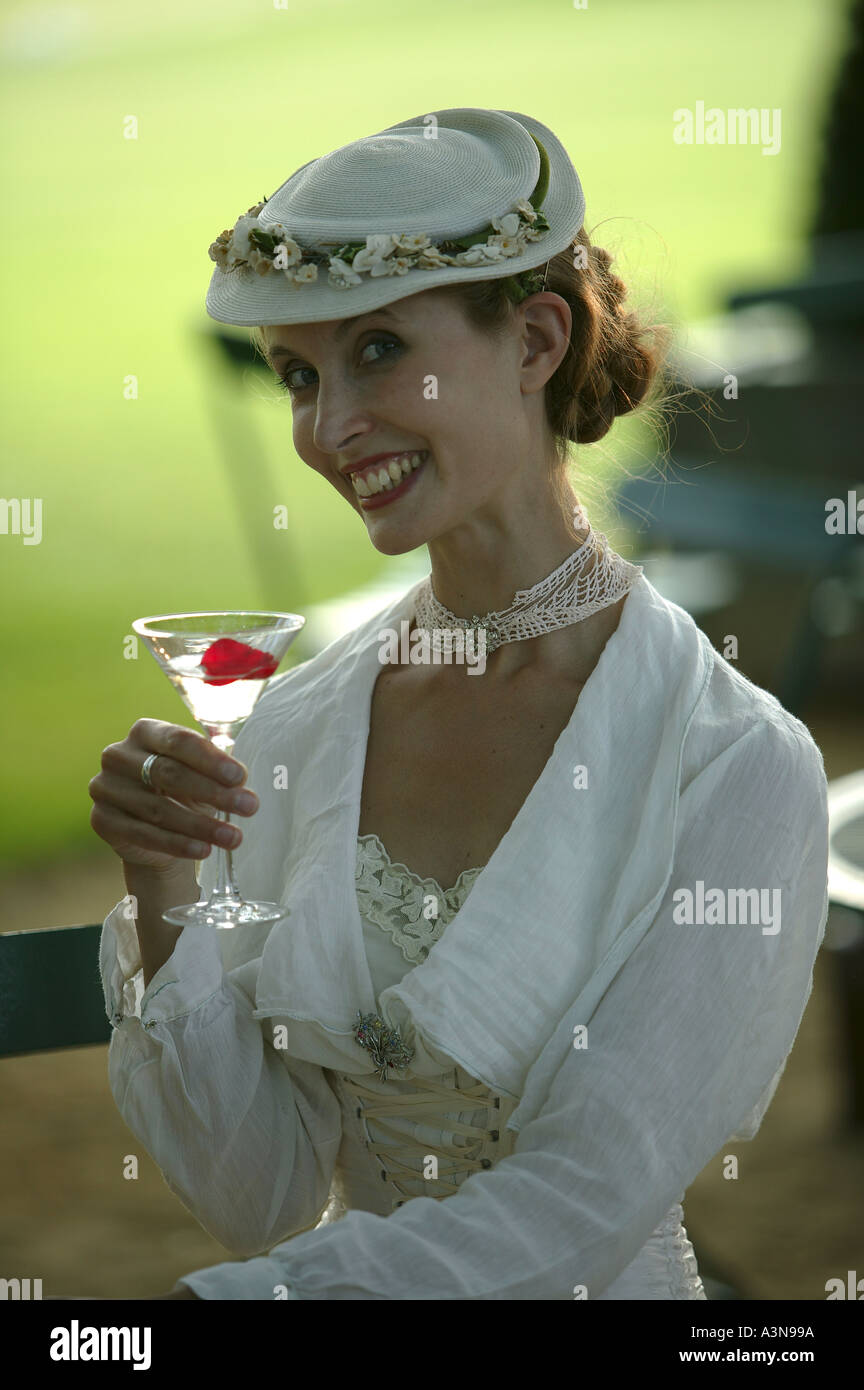 a traditional English girl drinking a martini Stock Photo - Alamy