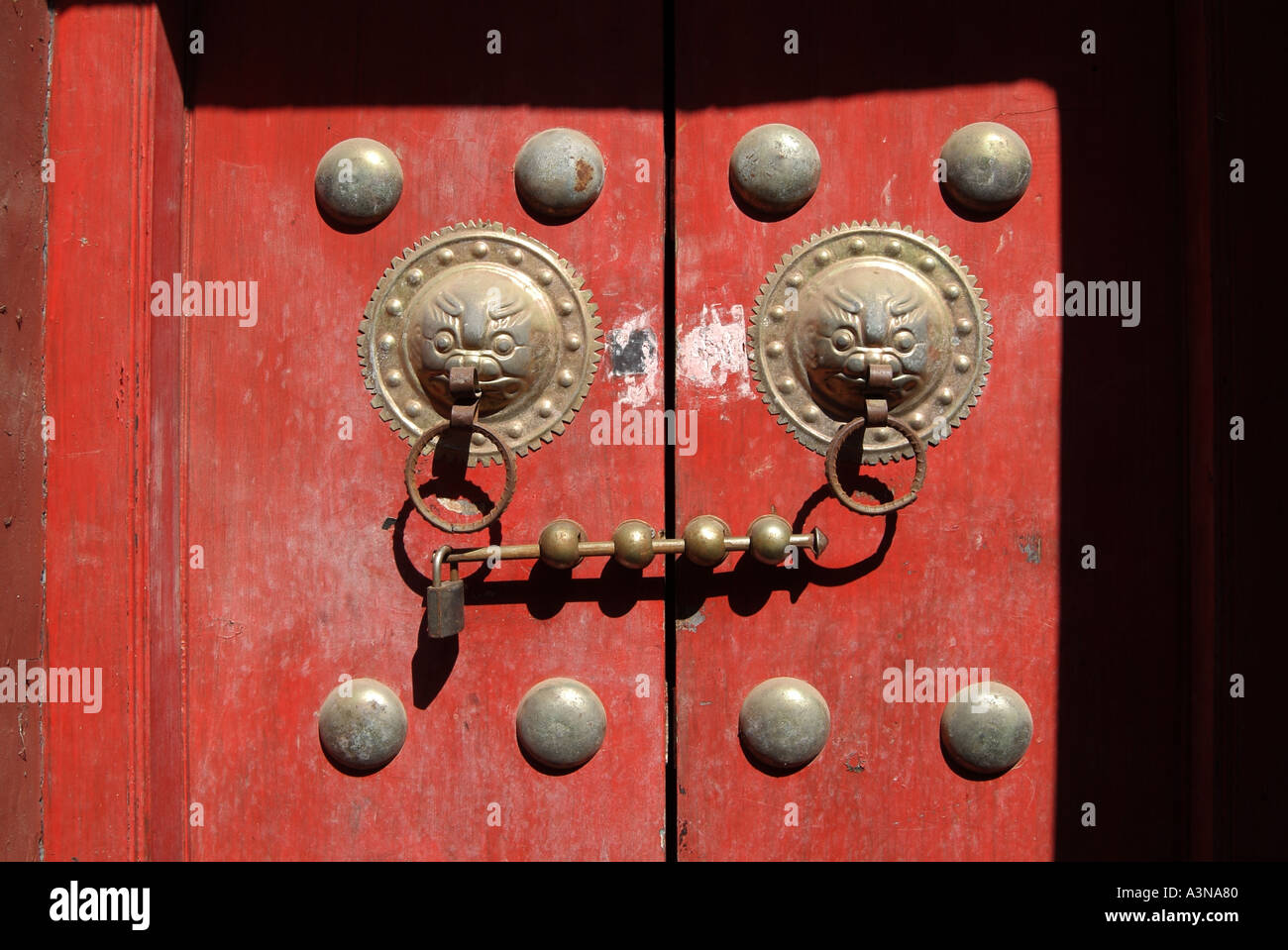 An ancient chinese doorknocker and door lock Stock Photo - Alamy