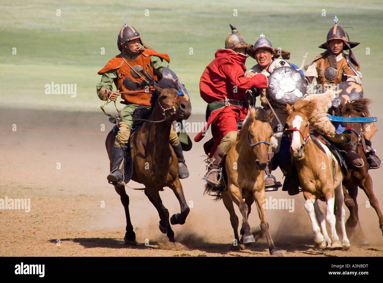 Four Armed Mongolian horsemen riding in close formation Stock Photo - Alamy