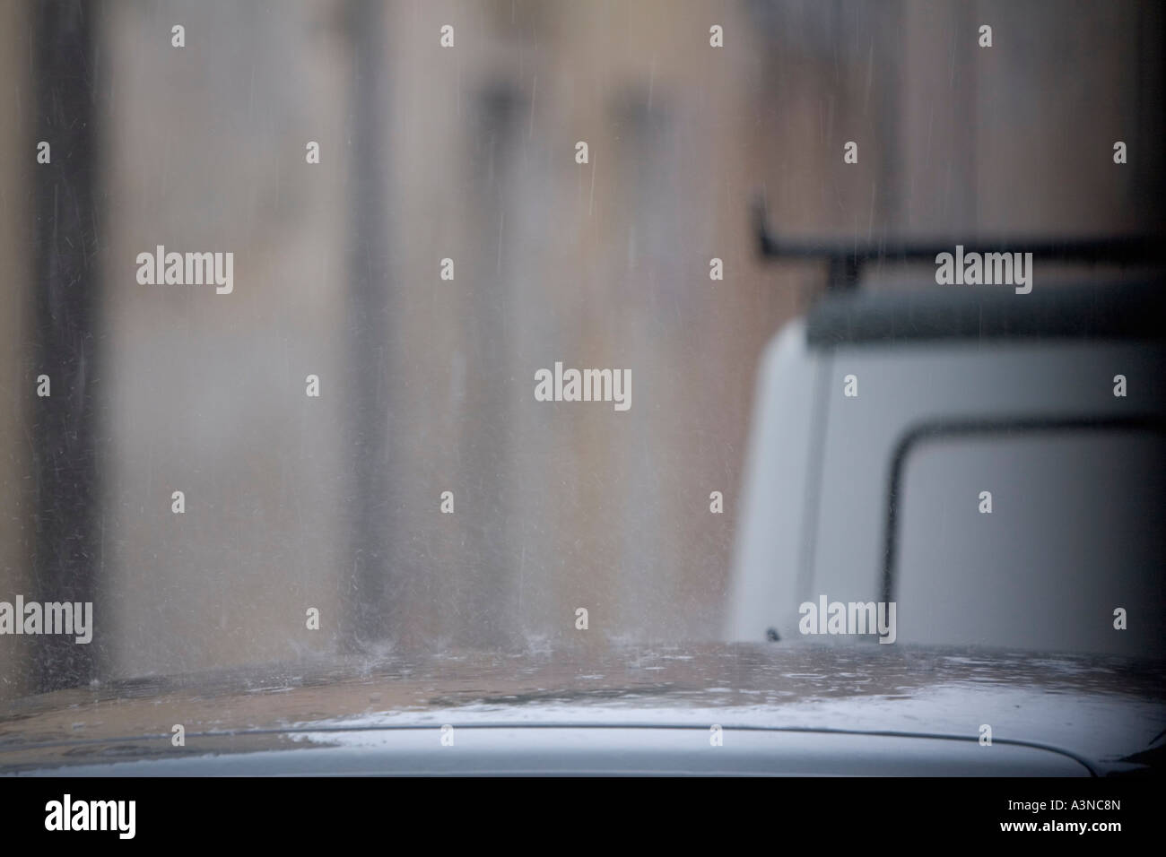 heavy rain falling on car roof Stock Photo - Alamy