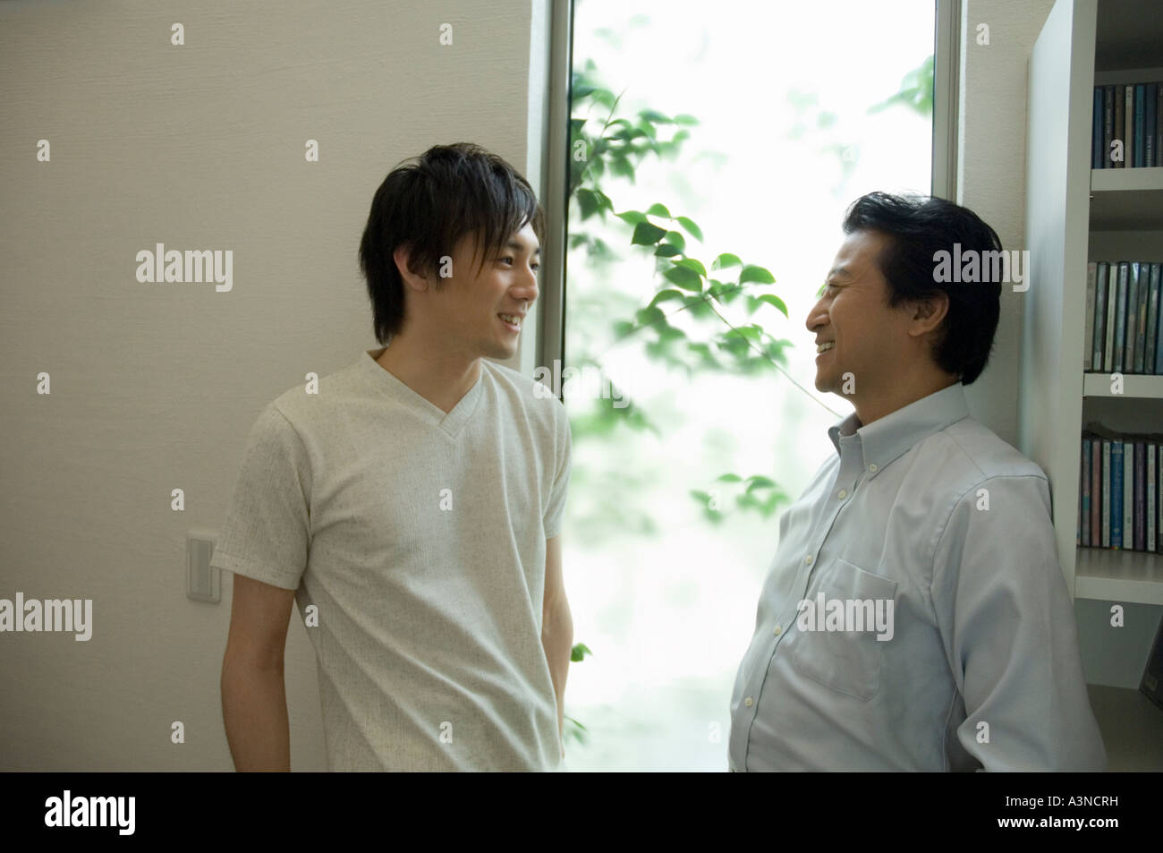 Father and son talking Stock Photo - Alamy