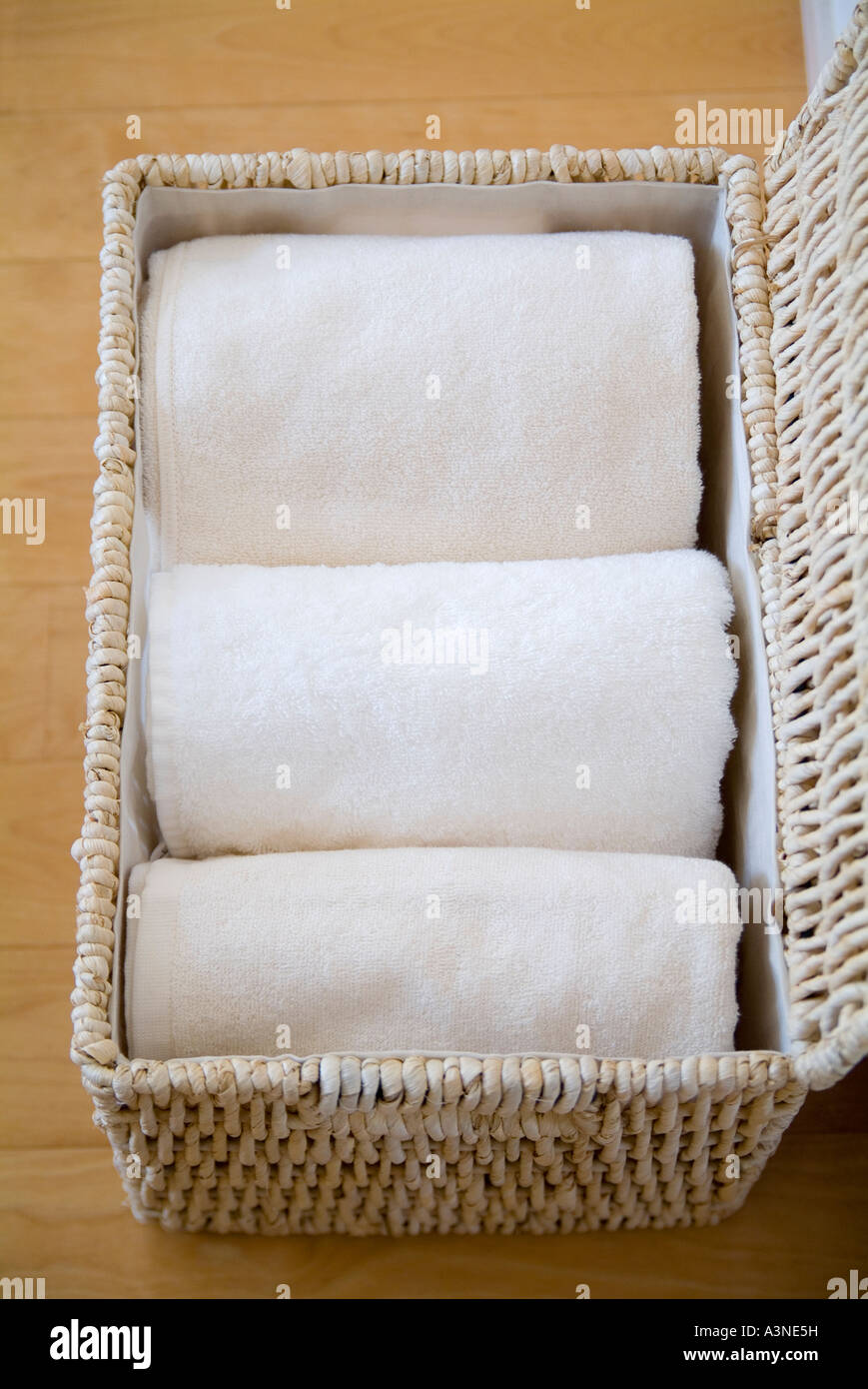 Towels in a basket Stock Photo - Alamy