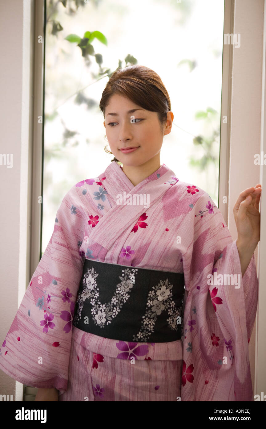 Portrait of a young woman wearing yukata Stock Photo - Alamy