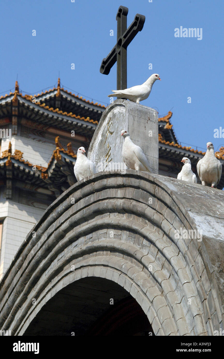 Cross and doves on top of a Christian church Beijing China Stock Photo ...