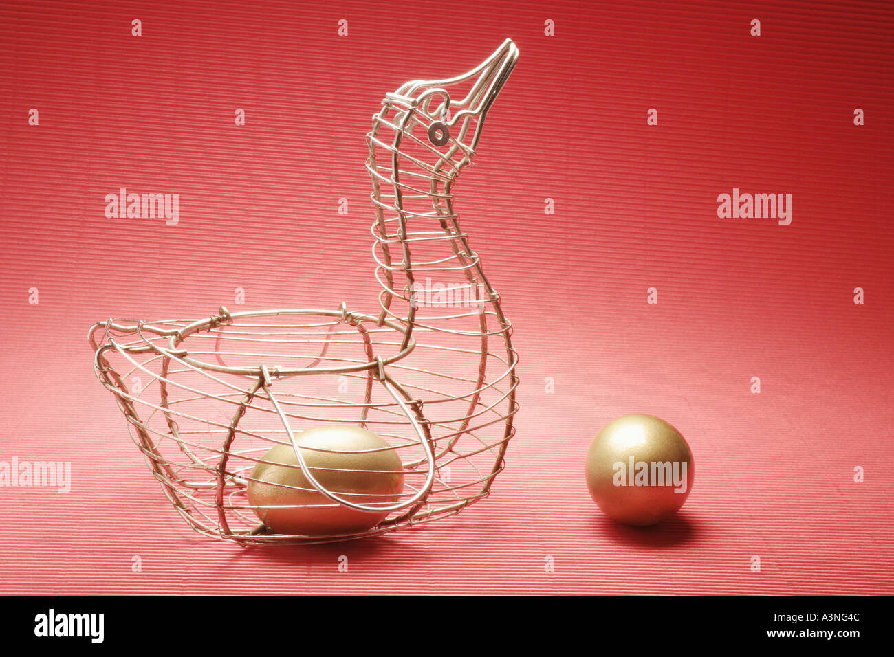 Goose Wire Basket with Golden Eggs Stock Photo - Alamy