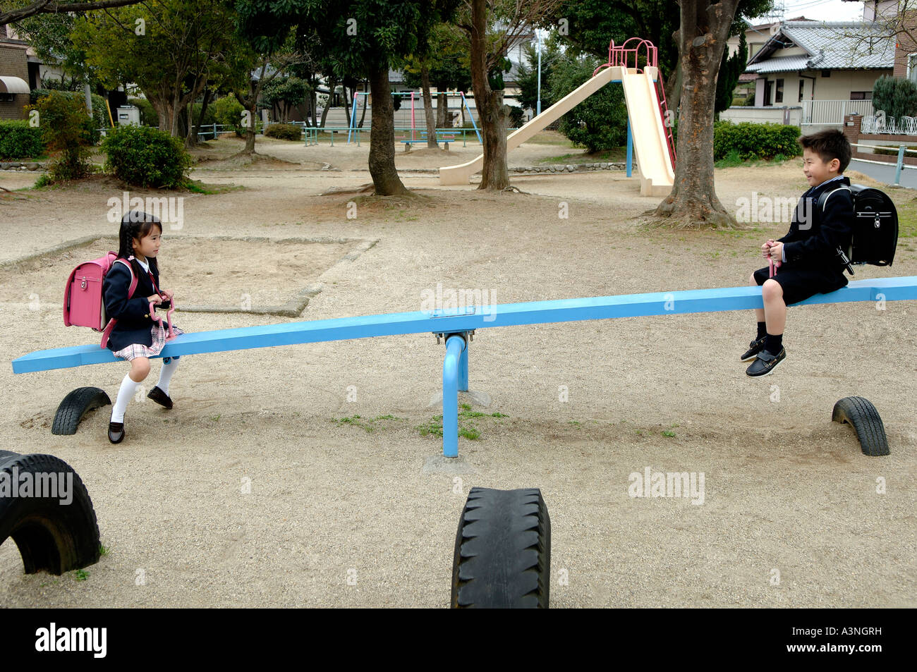 Two boys seesaw hi-res stock photography and images - Alamy