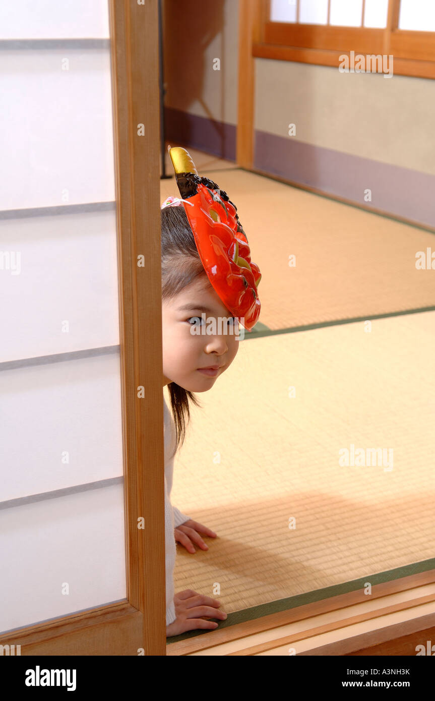 A girl wearing mask of red evil Stock Photo - Alamy