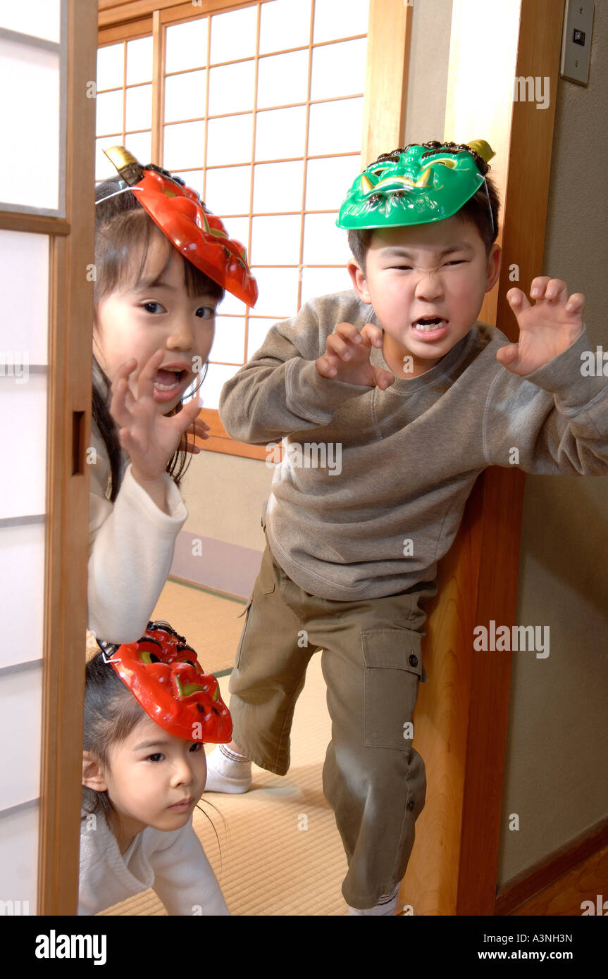 Children wearing mask of red evil Stock Photo - Alamy