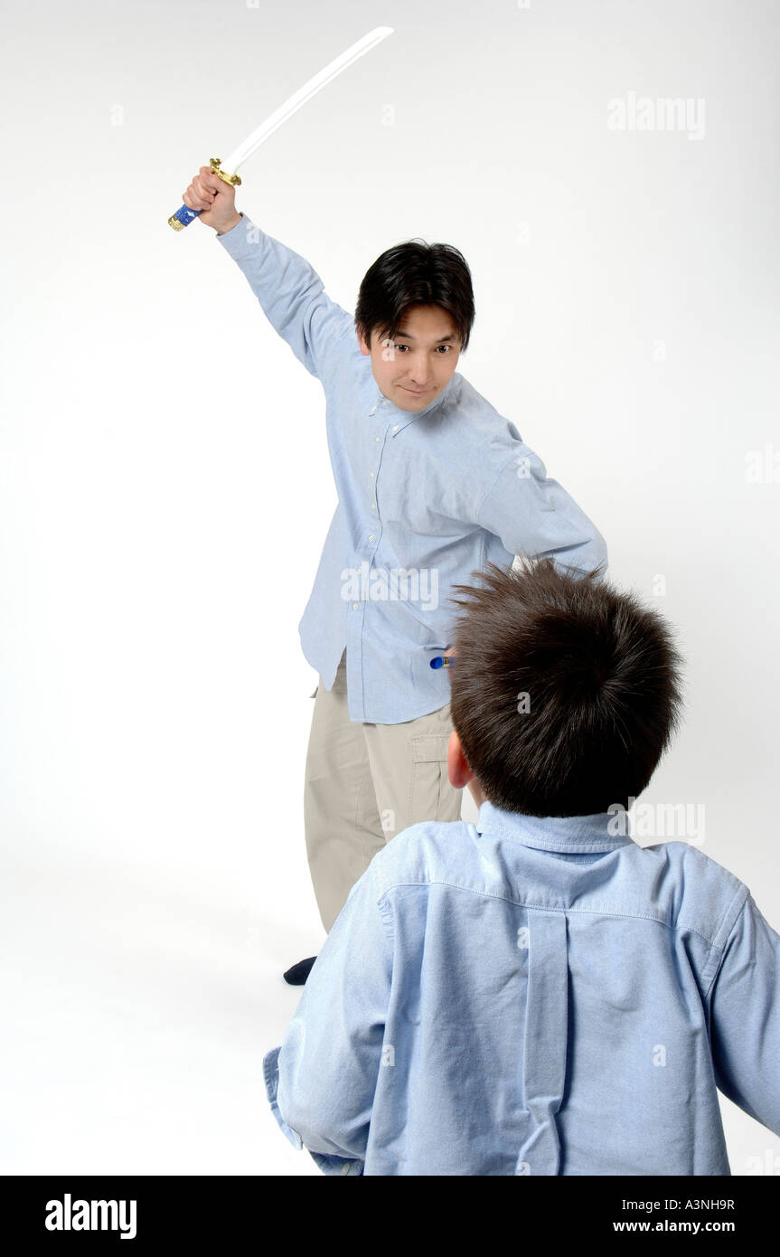 Father and son playing with sword Stock Photo - Alamy