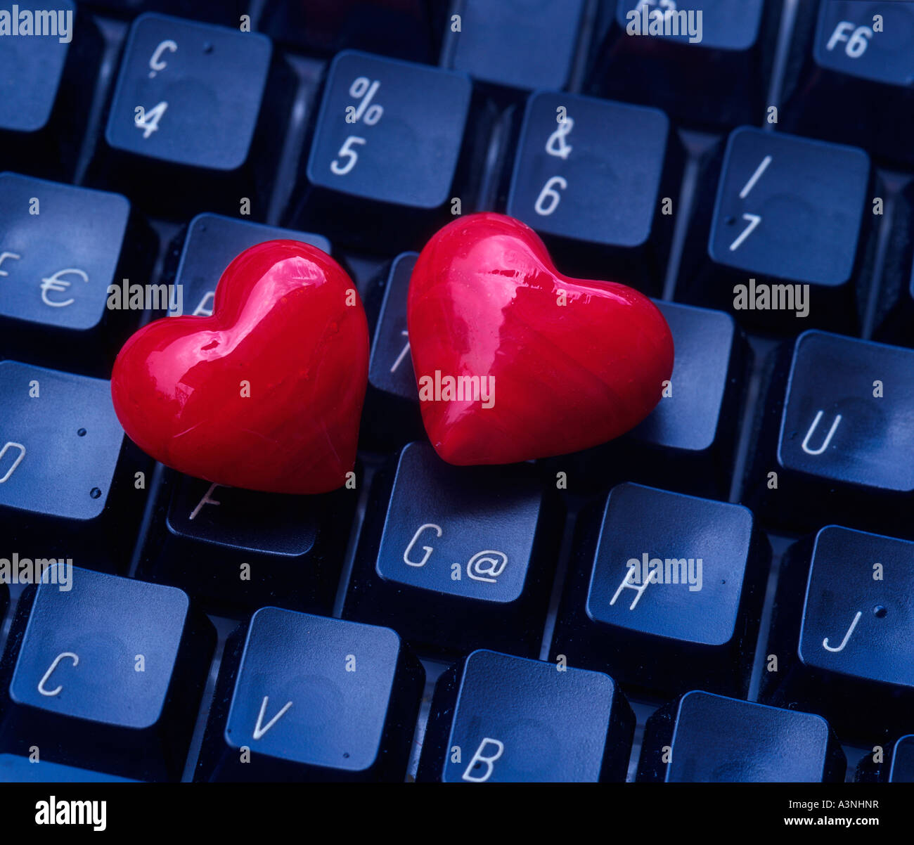 Red hearts on computer keyboard Stock Photo - Alamy