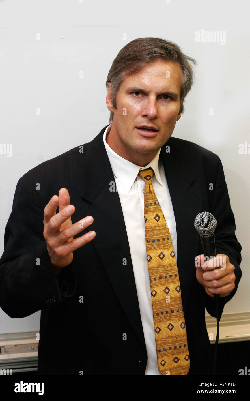 A businessman speaker with microphone Stock Photo - Alamy