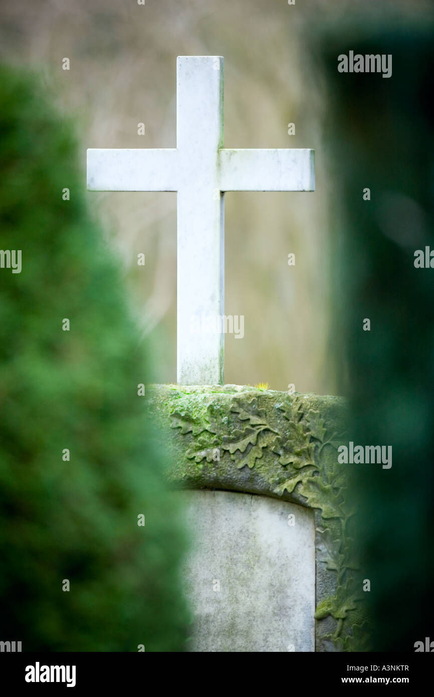 Cross on top of gravestone Stock Photo - Alamy
