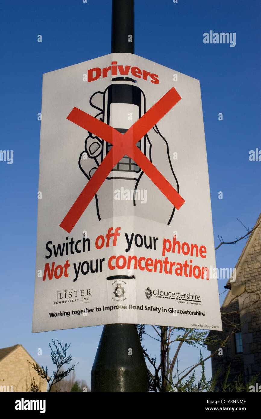 Signboard on lampost warning drivers not to use their mobile phones ...
